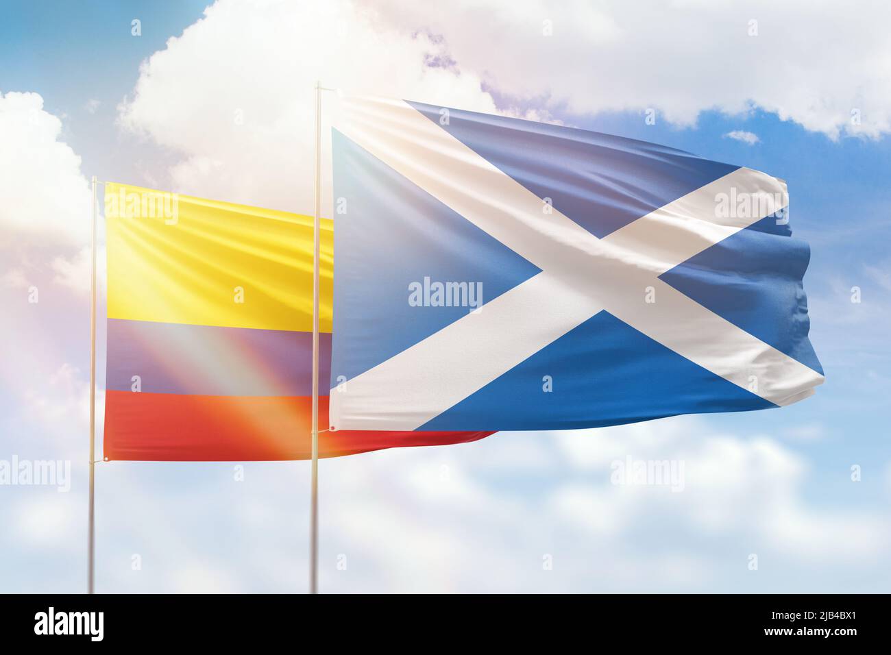 Sunny blue sky and flags of scotland and colombia Stock Photo - Alamy