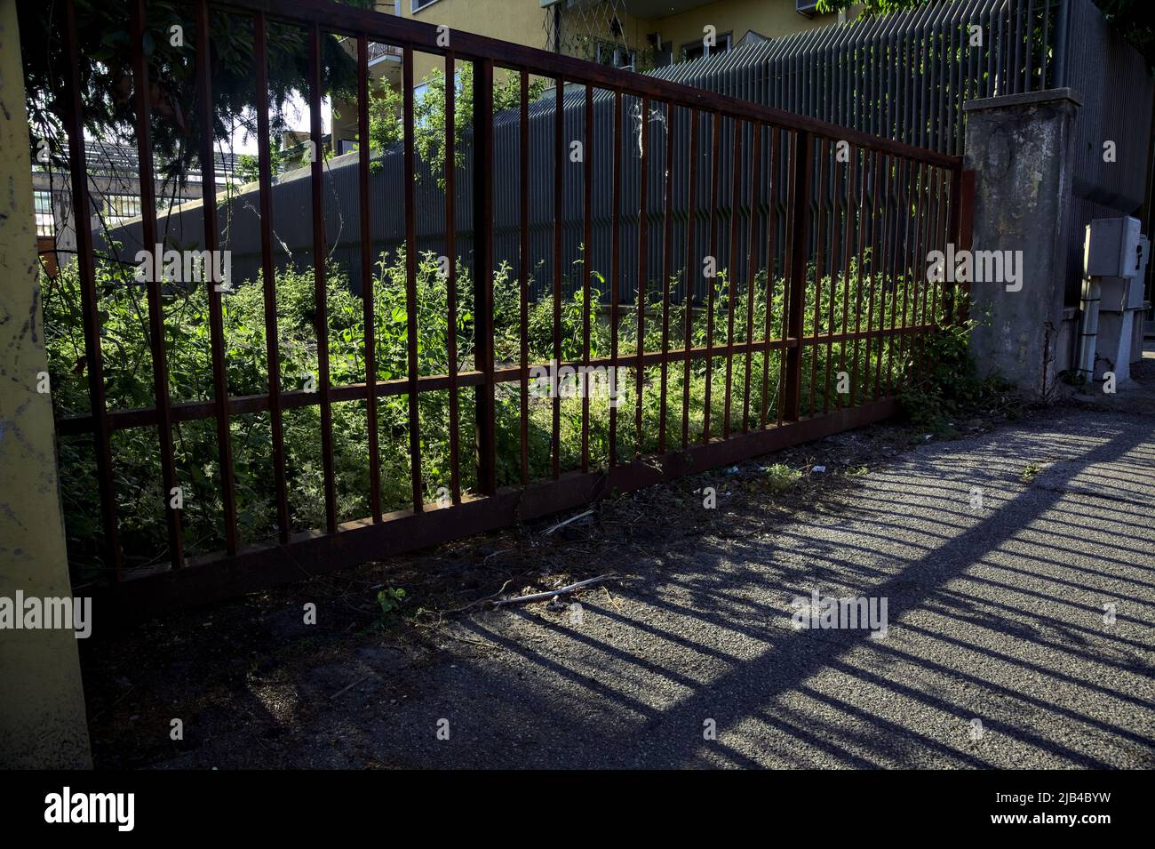 Rusty gate scary road hi-res stock photography and images - Alamy