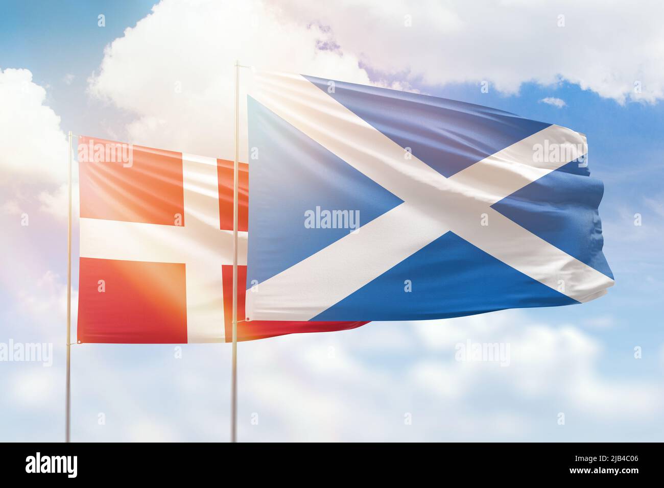 Sunny blue sky and flags of scotland and denmark Stock Photo - Alamy