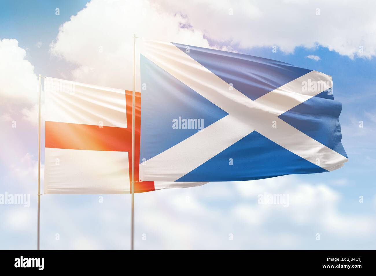 Sunny blue sky and flags of scotland and england Stock Photo - Alamy