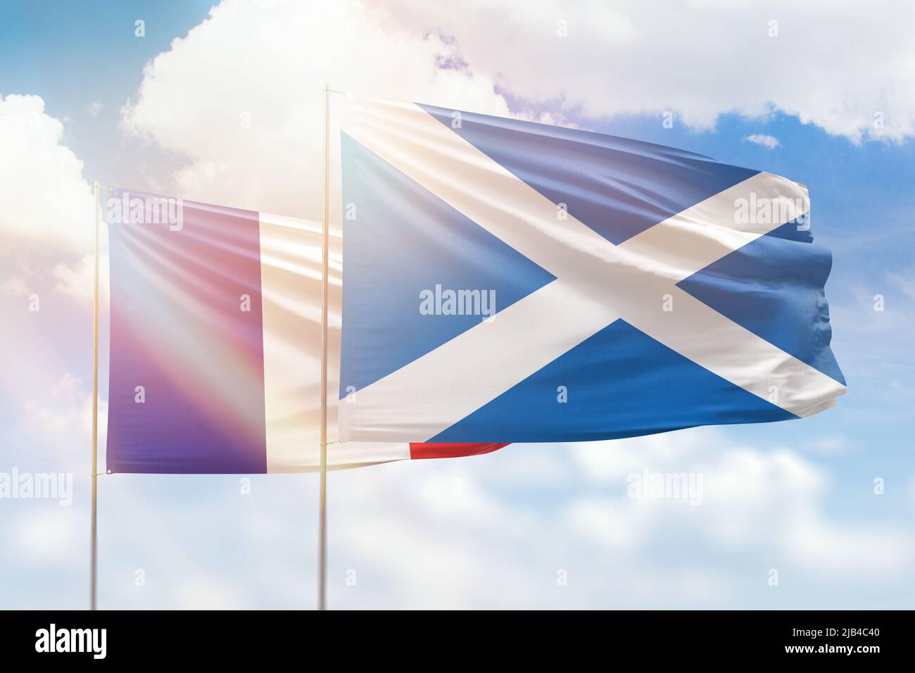 Sunny blue sky and flags of scotland and france Stock Photo - Alamy