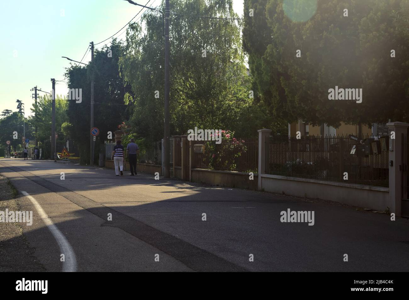 Street in a residential area of an italian town at sunset Stock Photo ...
