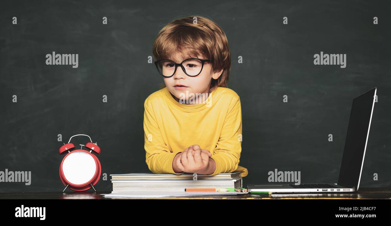 School kids against green chalkboard. Learning concept. Educational ...