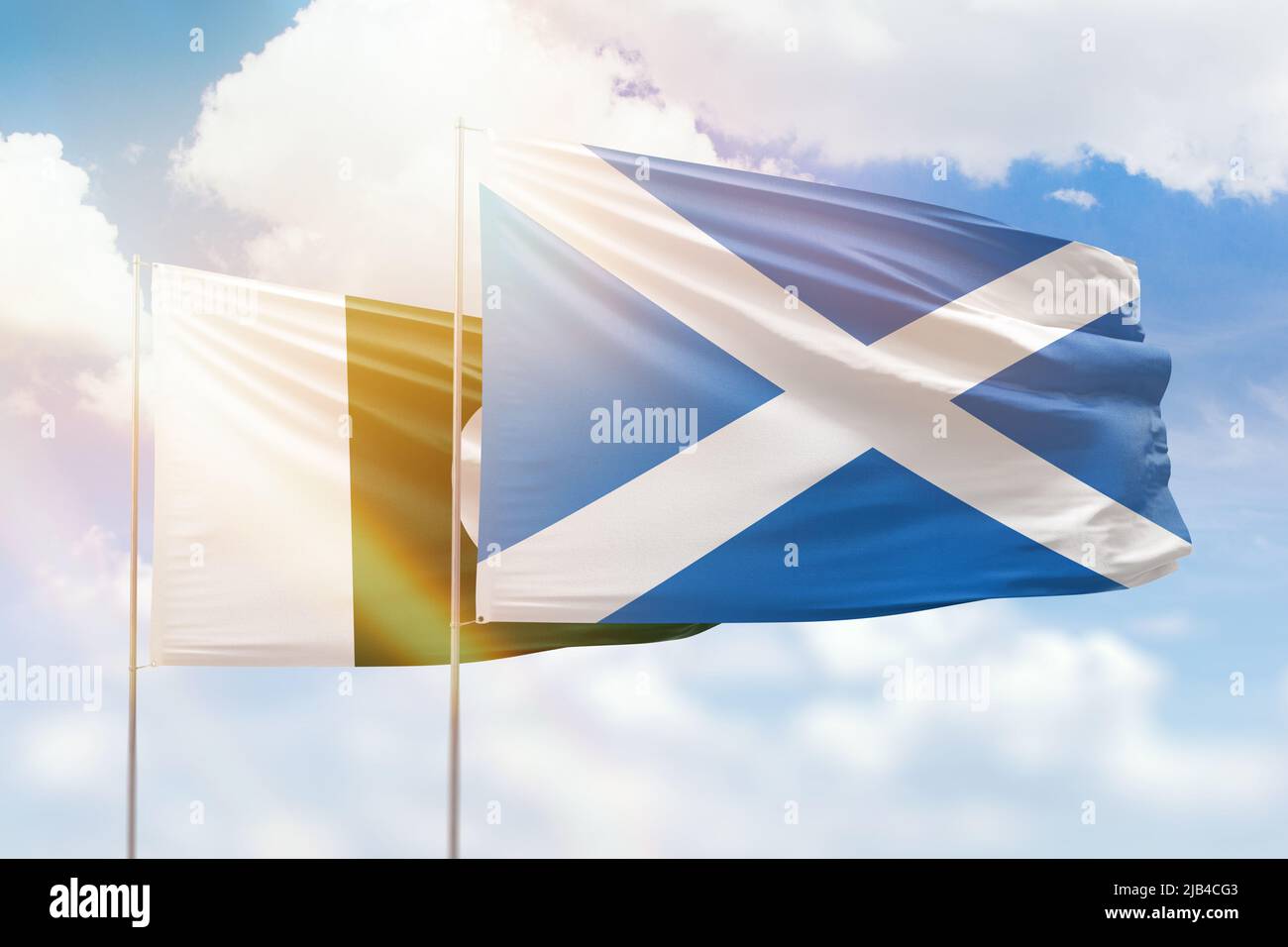 Sunny blue sky and flags of scotland and pakistan Stock Photo - Alamy