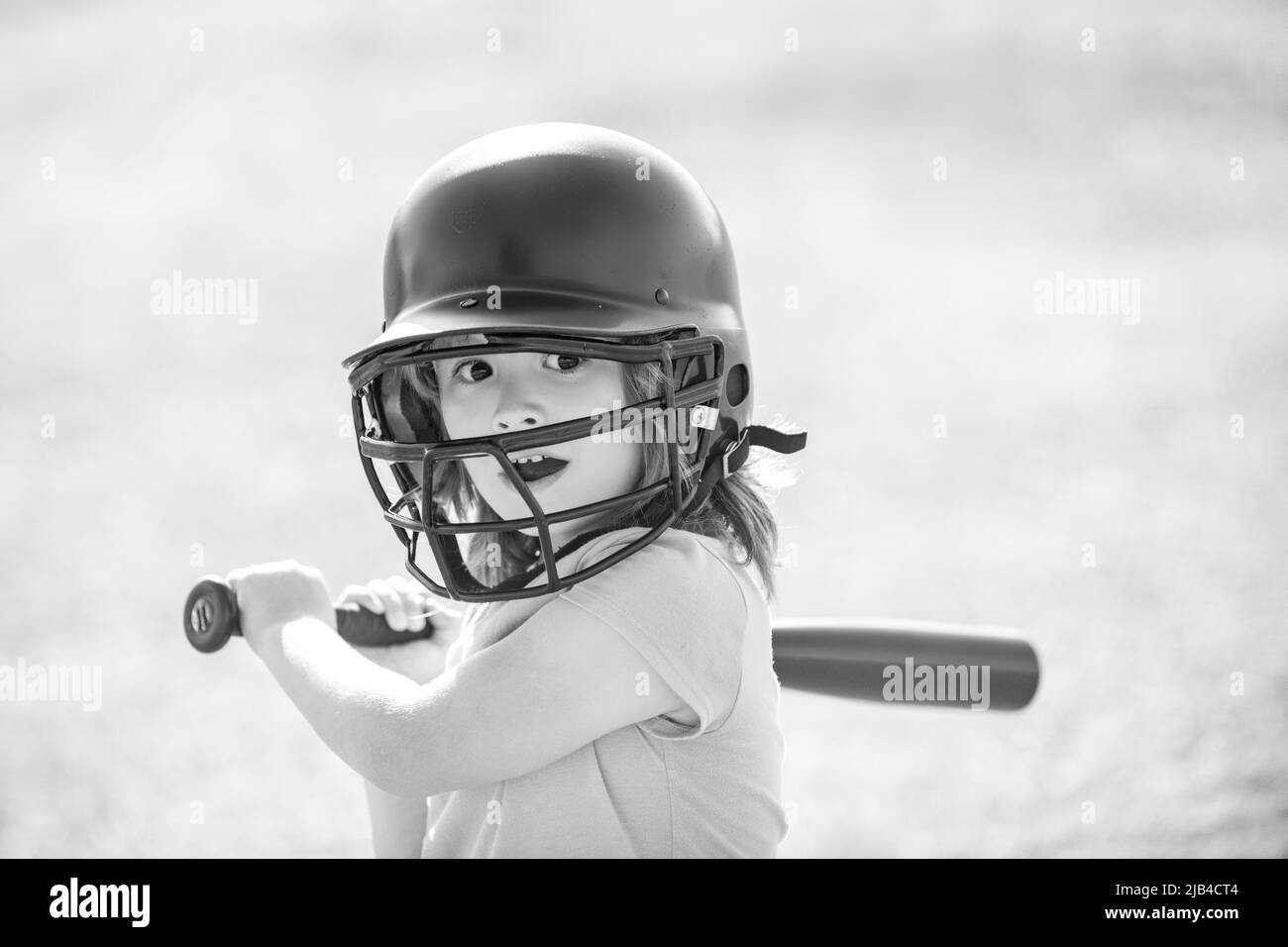 Baseball players kid swinging the bat at a fastball from the pitcher ...