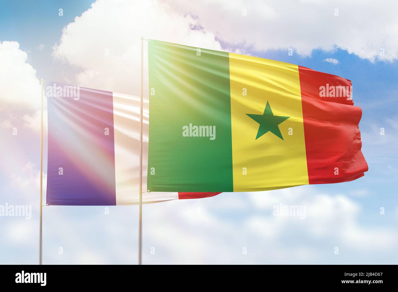 Sunny blue sky and flags of senegal and france Stock Photo - Alamy