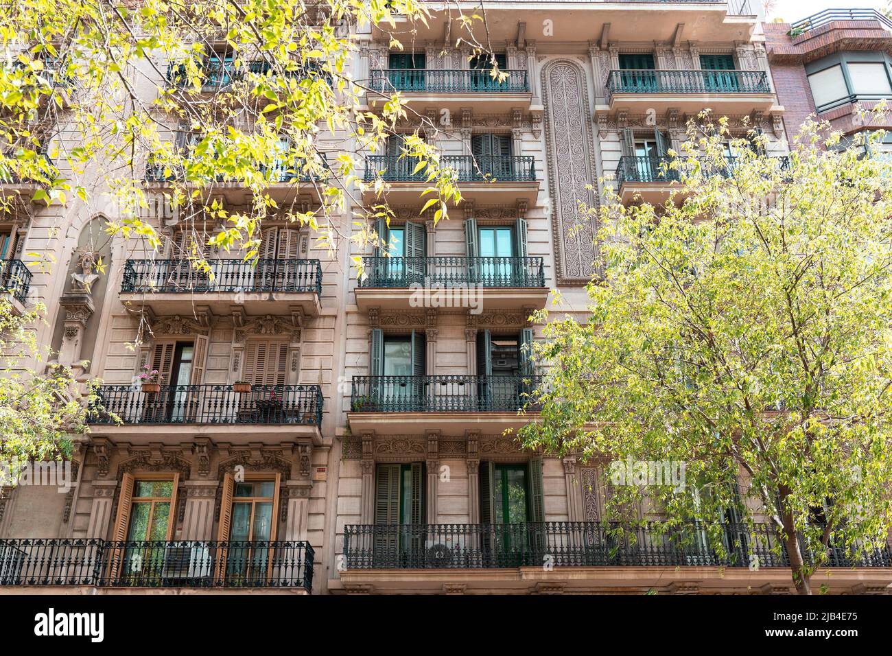 Classic apartment building with balconies and shutters in Barcelona ...