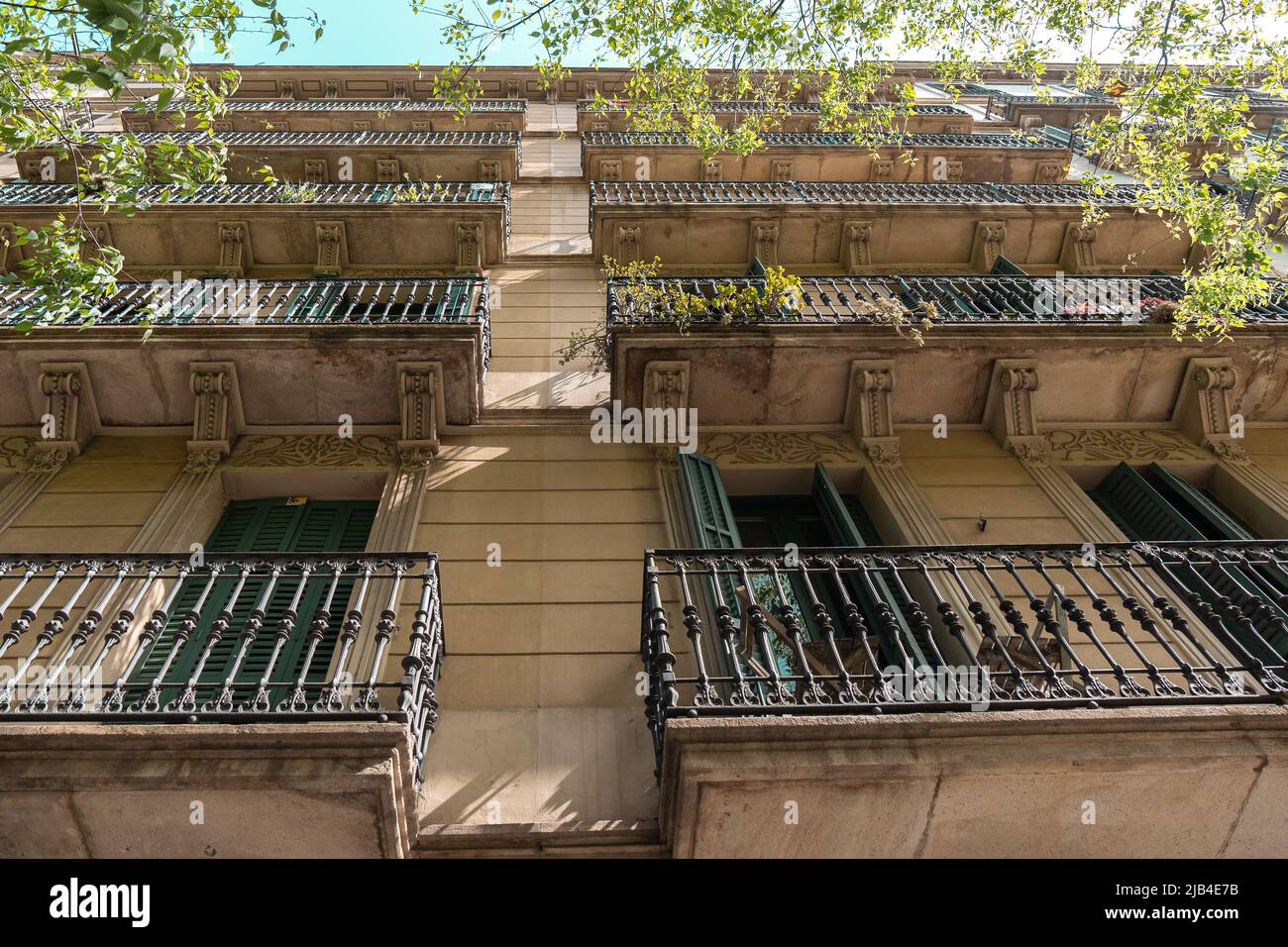 Classic apartment building with balconies and shutters in Barcelona ...