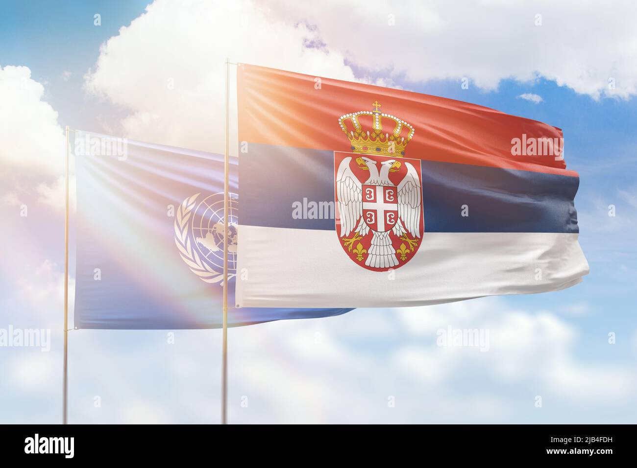 Sunny blue sky and flags of serbia and united nations Stock Photo - Alamy