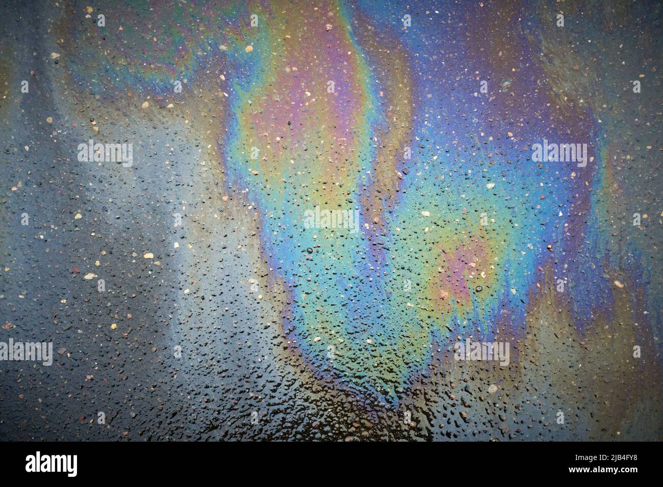 Texture of asphalt and rainbow stains Stock Photo - Alamy