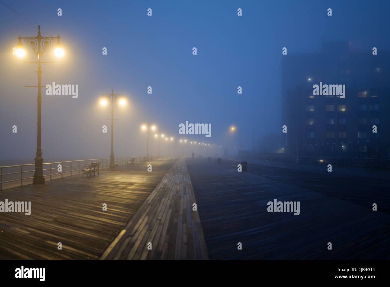 Street lights, foggy misty night, lamp post lanterns, deserted road in ...