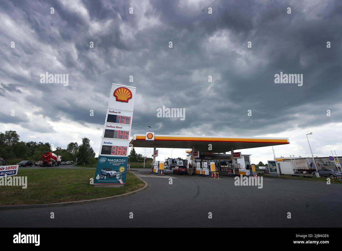 A view of Shell gas station with a cloudy sky in the background. (Photo ...