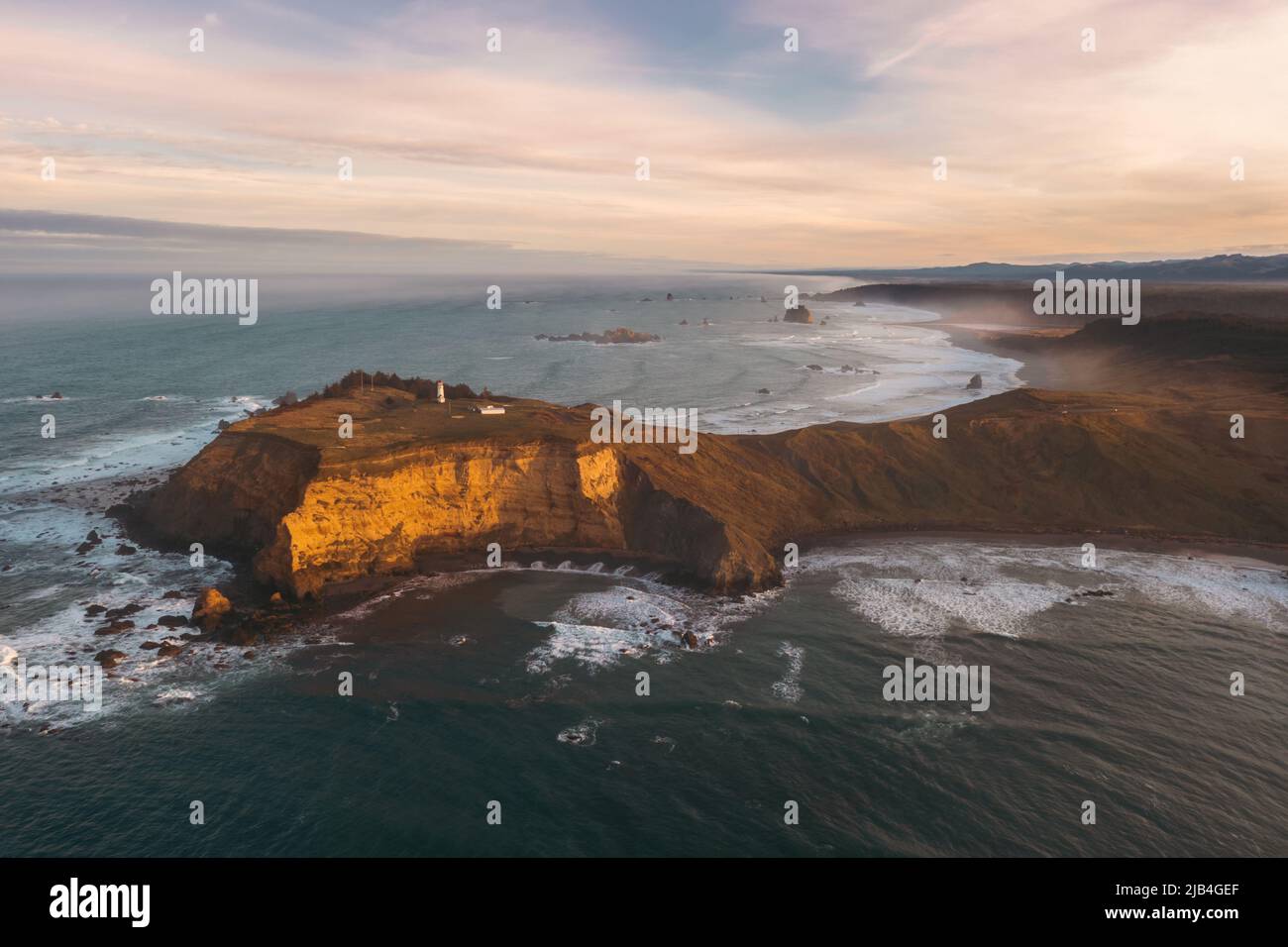 Cape Blanco Lighthouse at Southern Oregon Coast, dramatic sunrise drone ...