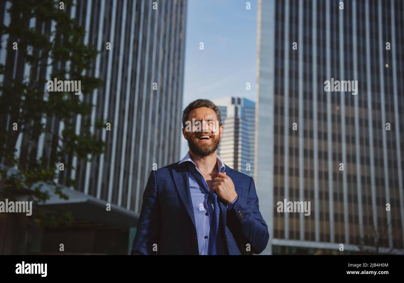 Tired businessman after hard working day near office. Business concept ...
