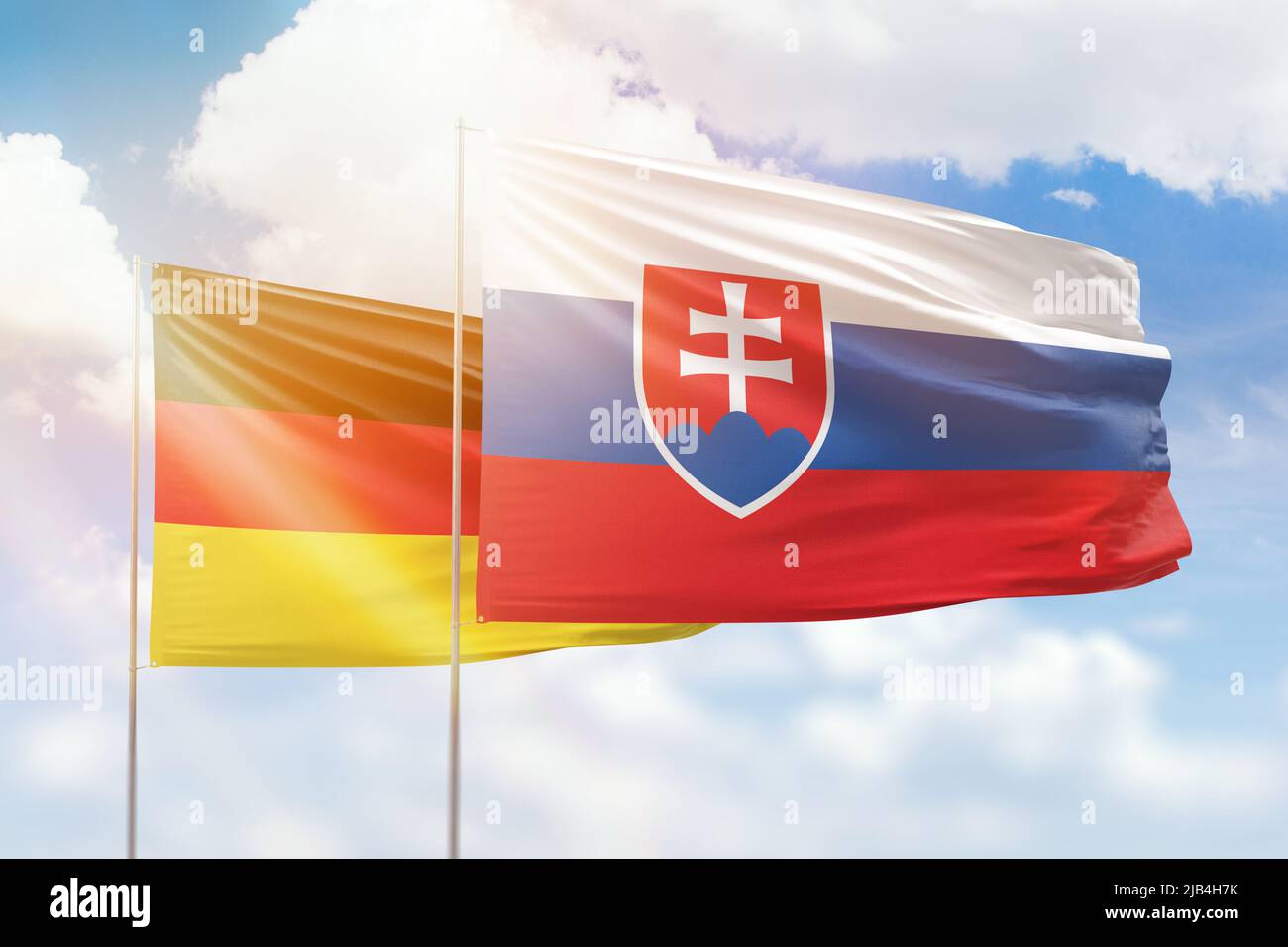 Sunny blue sky and flags of slovakia and germany Stock Photo - Alamy