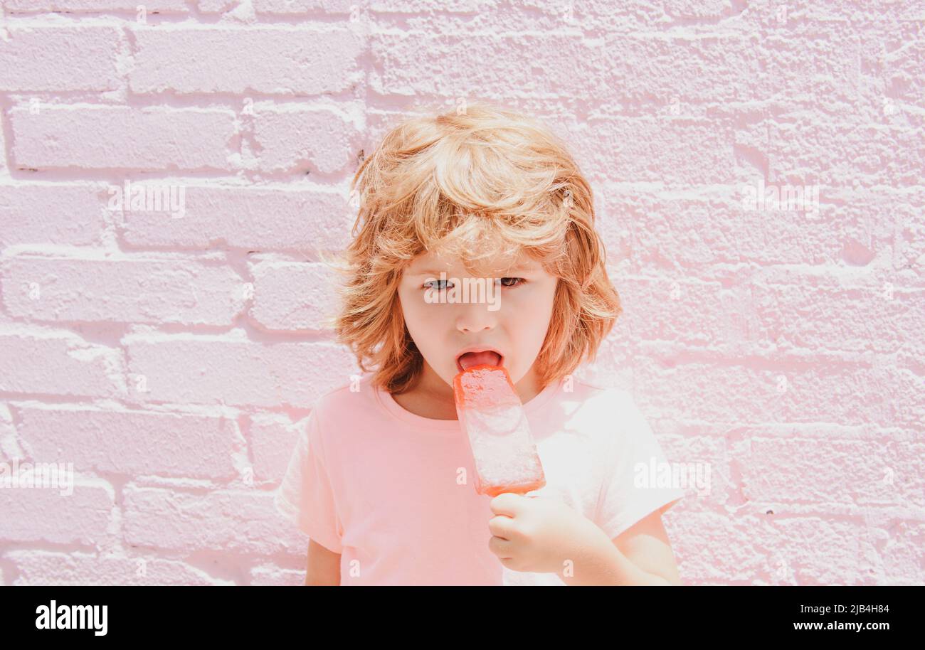 Kids holding ice cream on pink background Stock Photo - Alamy