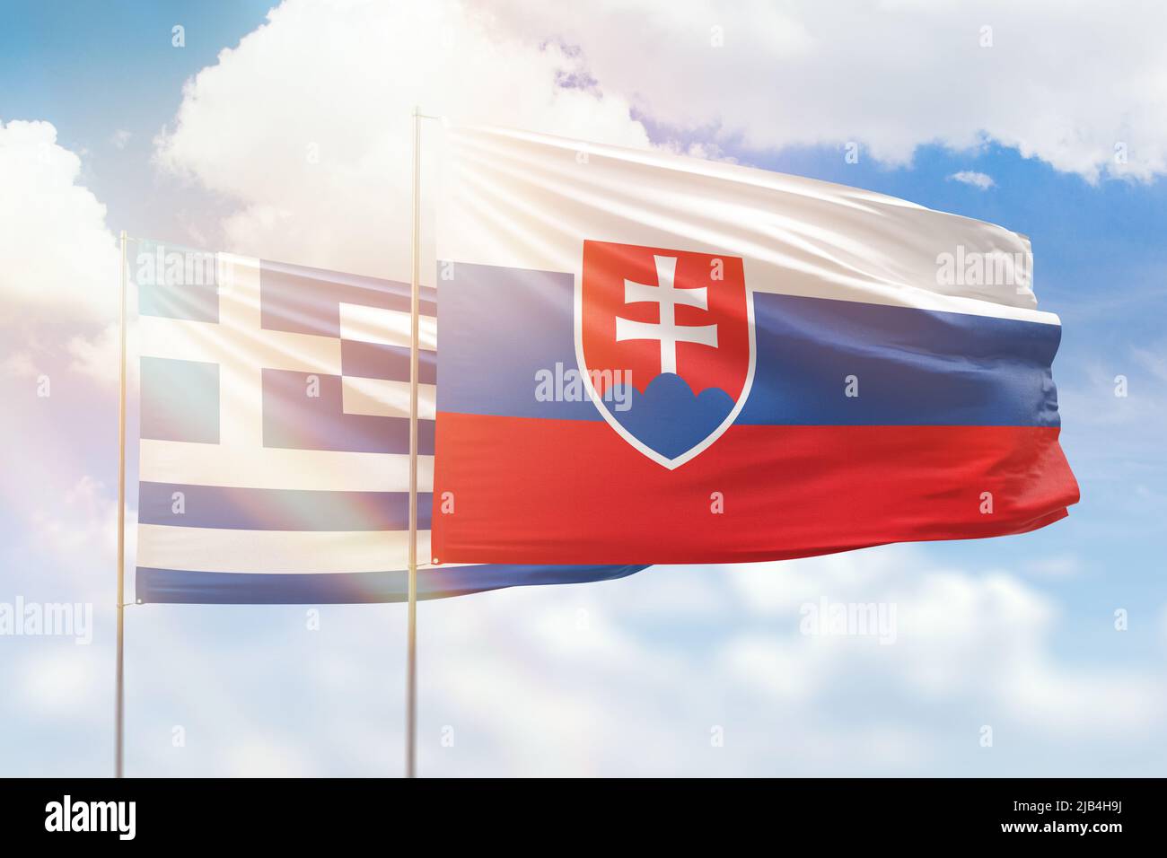 Sunny blue sky and flags of slovakia and greece Stock Photo - Alamy