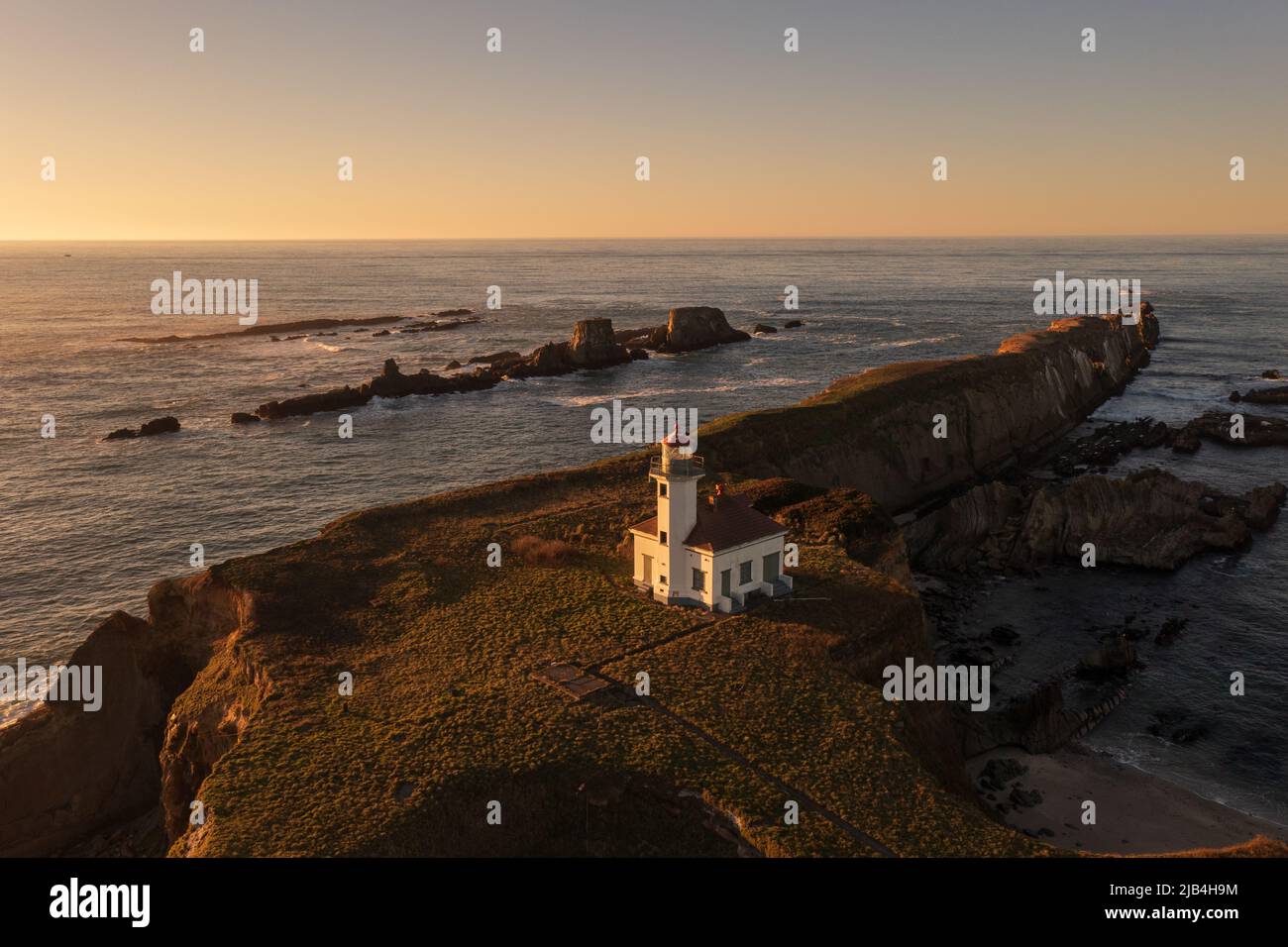 Cape Arago Lighthouse at the Oregon Coast at sunset Stock Photo - Alamy