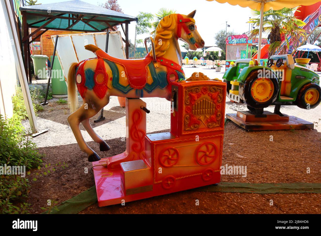 Coin operated amusement kiddie rides Stock Photo - Alamy