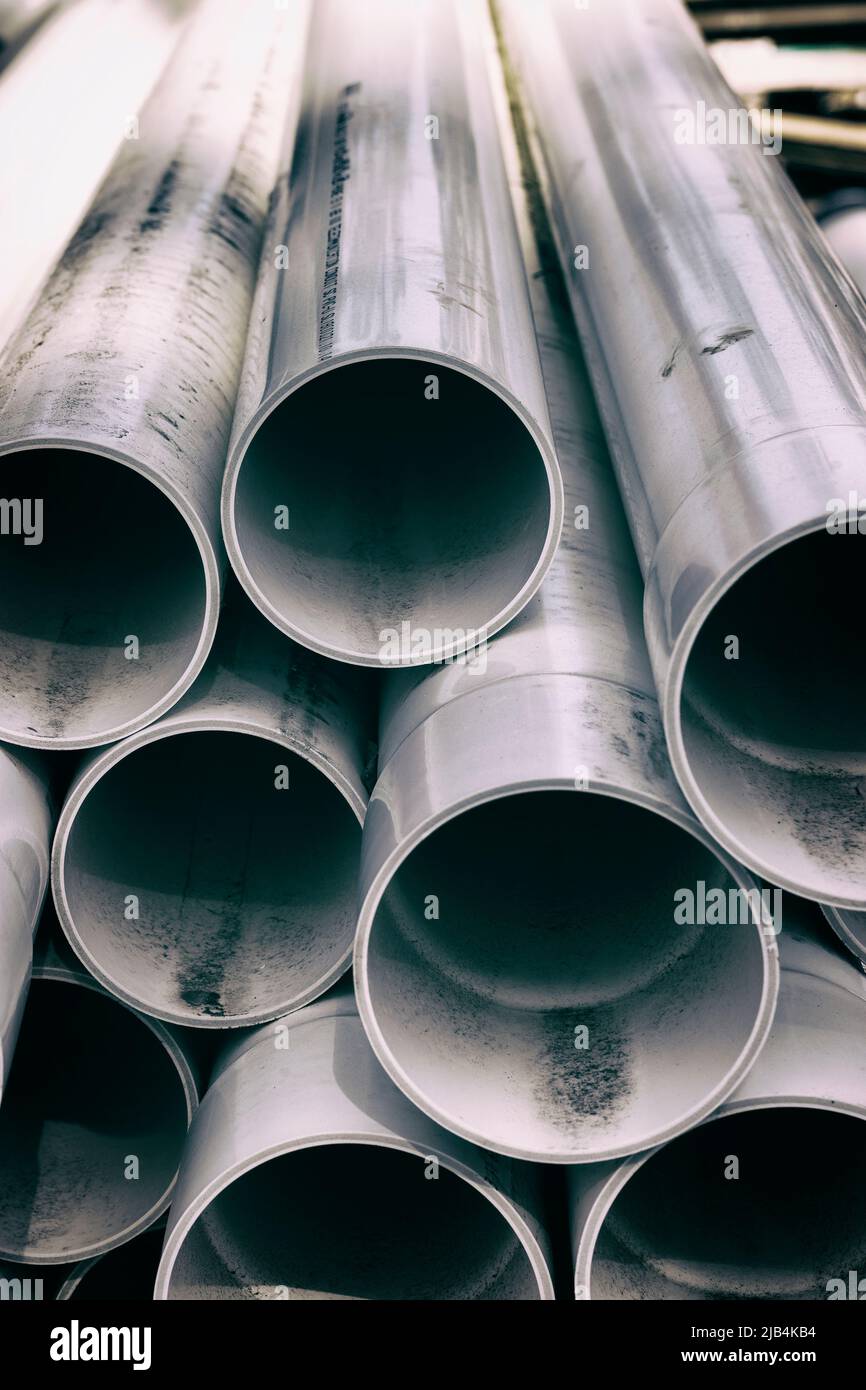 pipes stacked in preparation for construction Stock Photo - Alamy