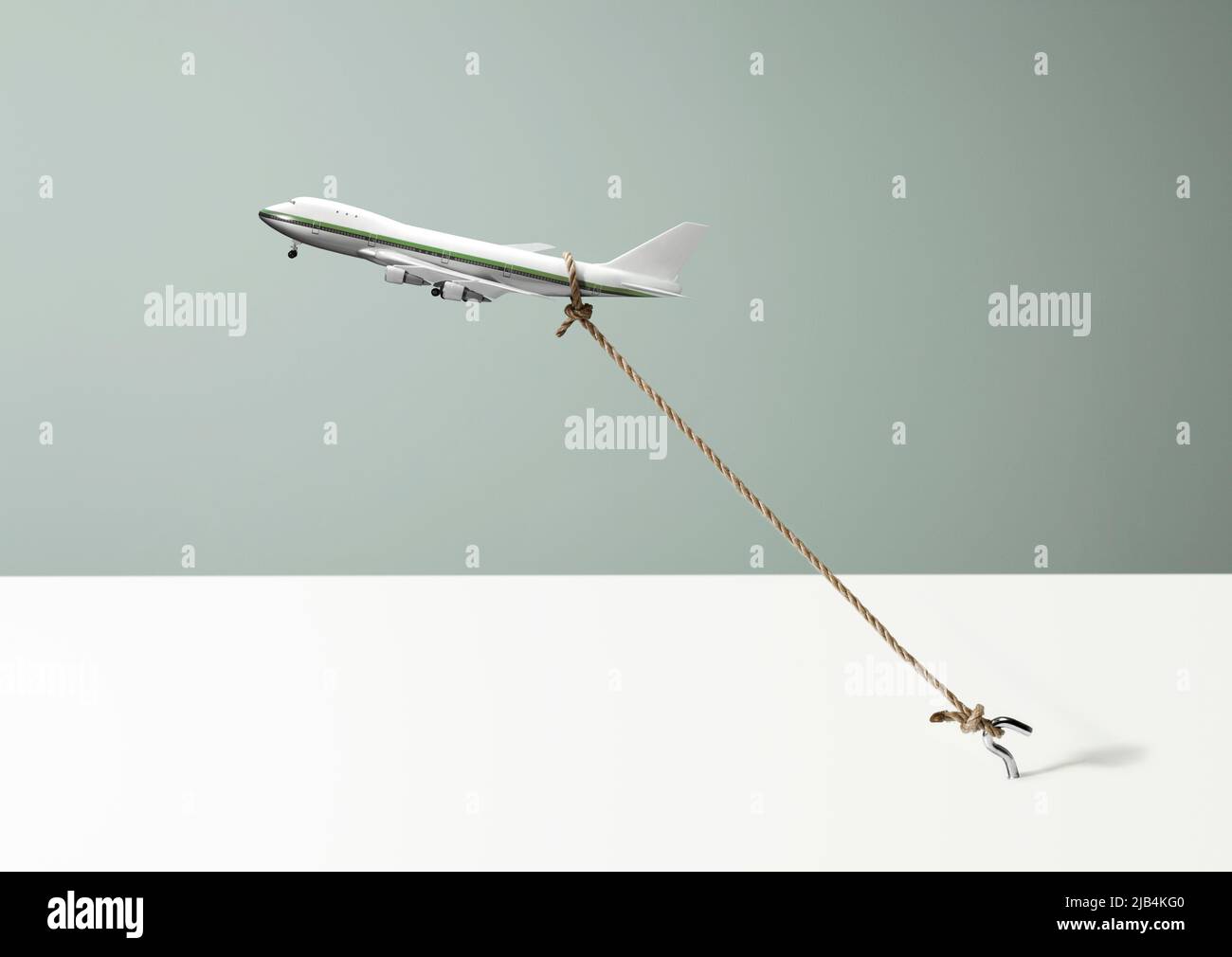 Airliner tied by rope from taking off Stock Photo - Alamy