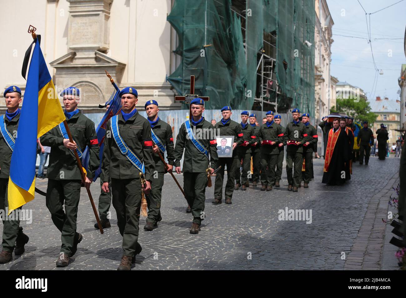 The funeral procession moves along the streets during the farewell ...