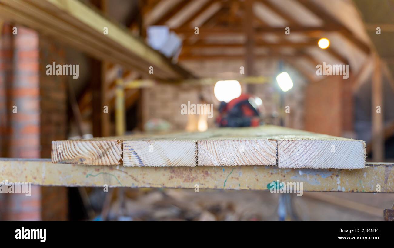 Smooth saw cut of flat boards close-up at a construction site. Wood ...