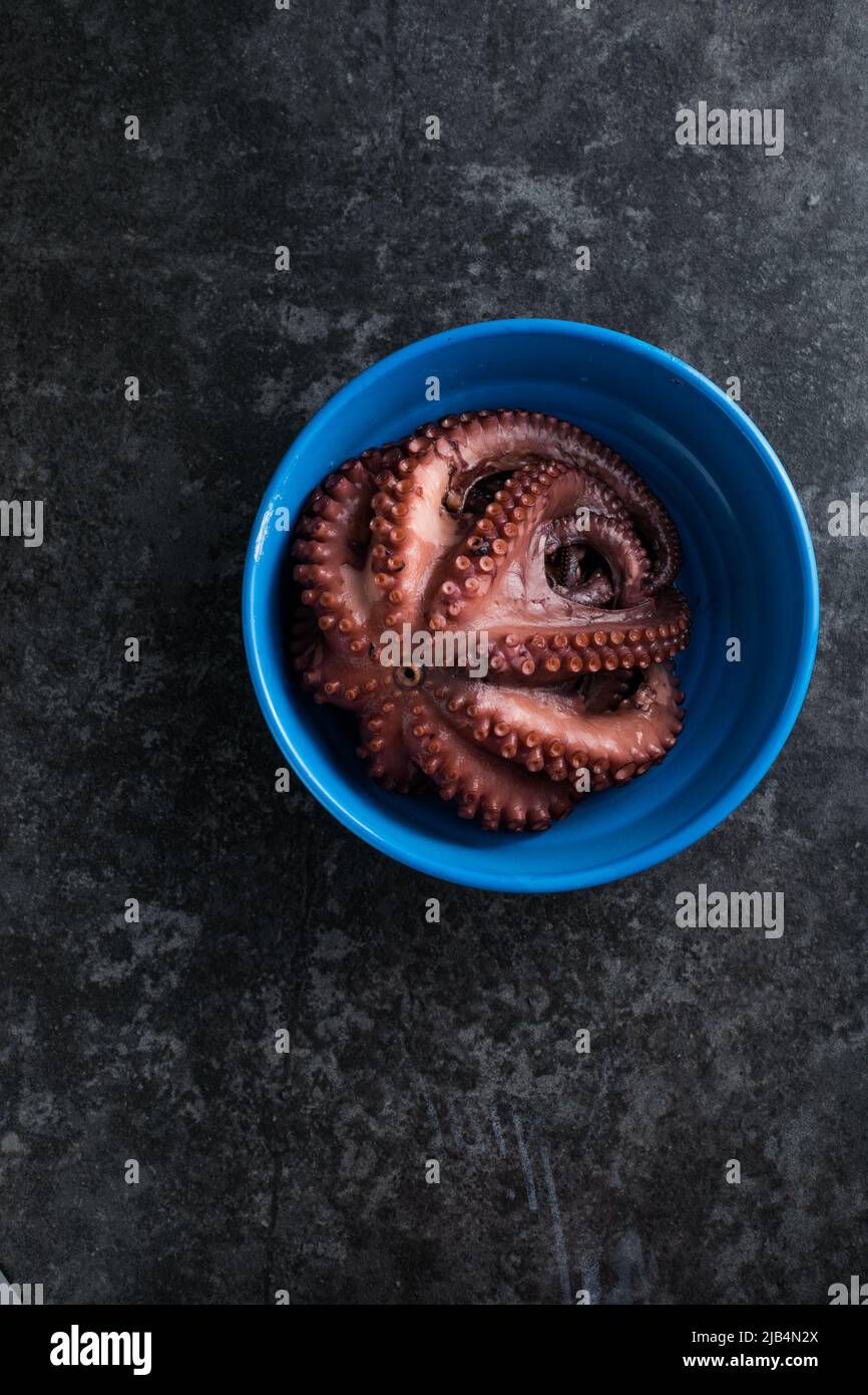 Octopus is boiled in a pot Stock Photo - Alamy