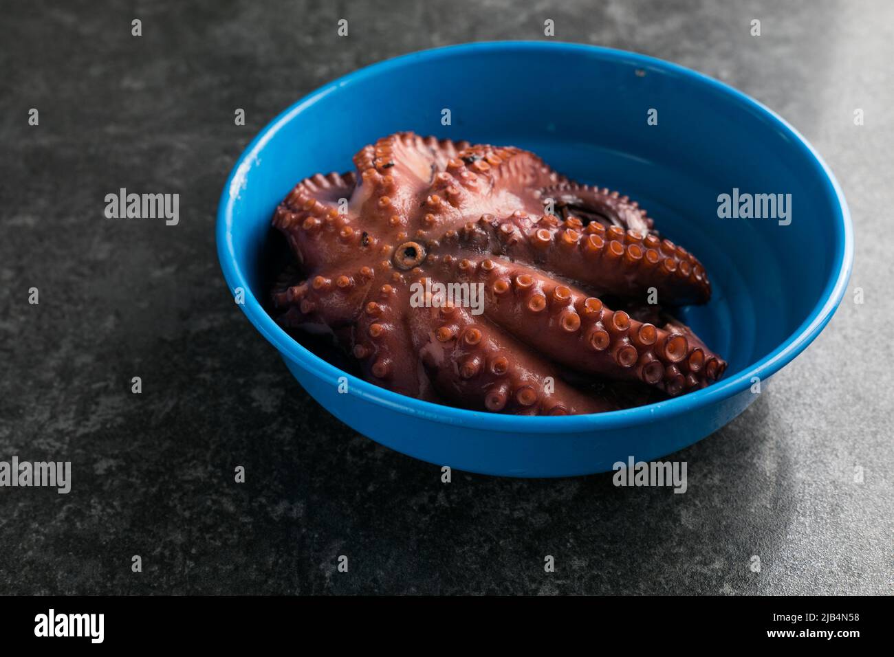 Octopus is boiled in a pot Stock Photo - Alamy
