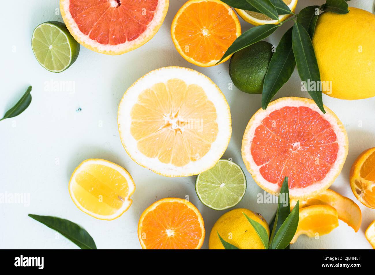 Fresh slices of different types of citrus: Orange, lime,lemon ...