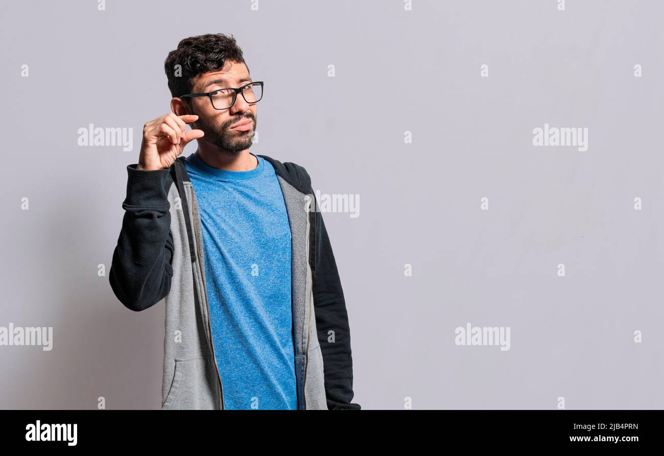 Person showing a small amount with his fingers, people gesturing with ...