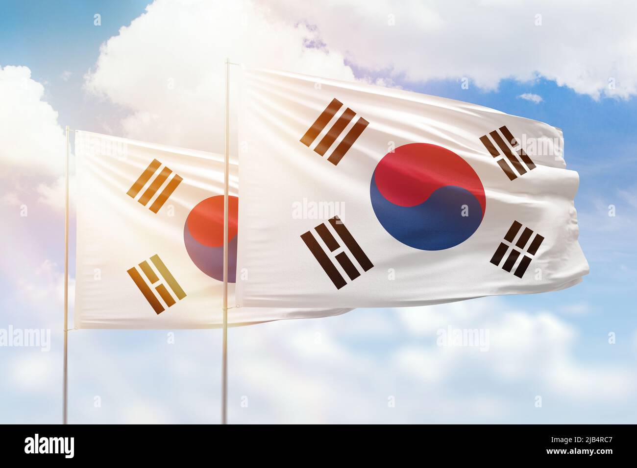 Sunny blue sky and flags of south korea and south korea Stock Photo - Alamy