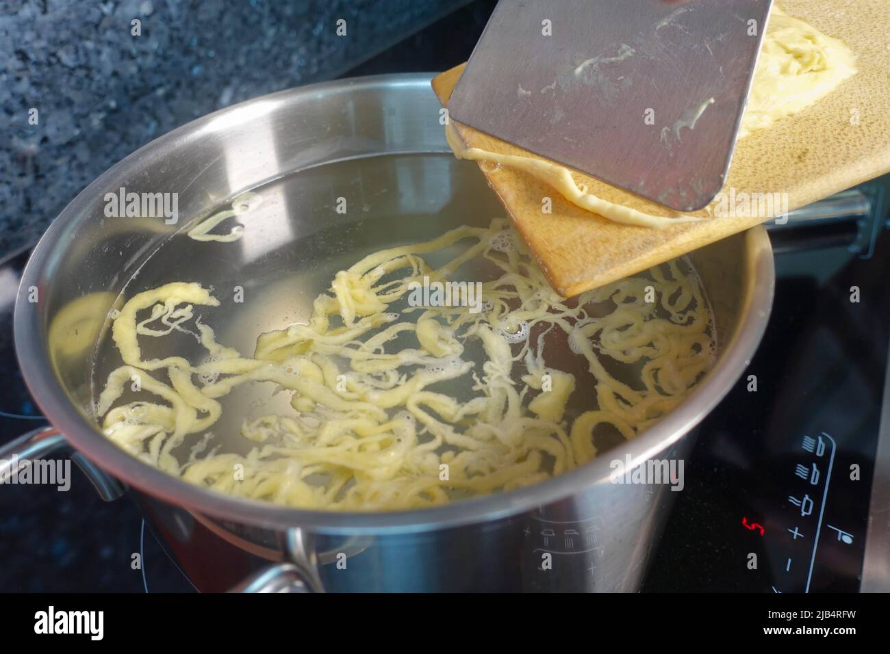 Swabian cuisine, preparation of hand-scraped spaetzle for spaetzle ...