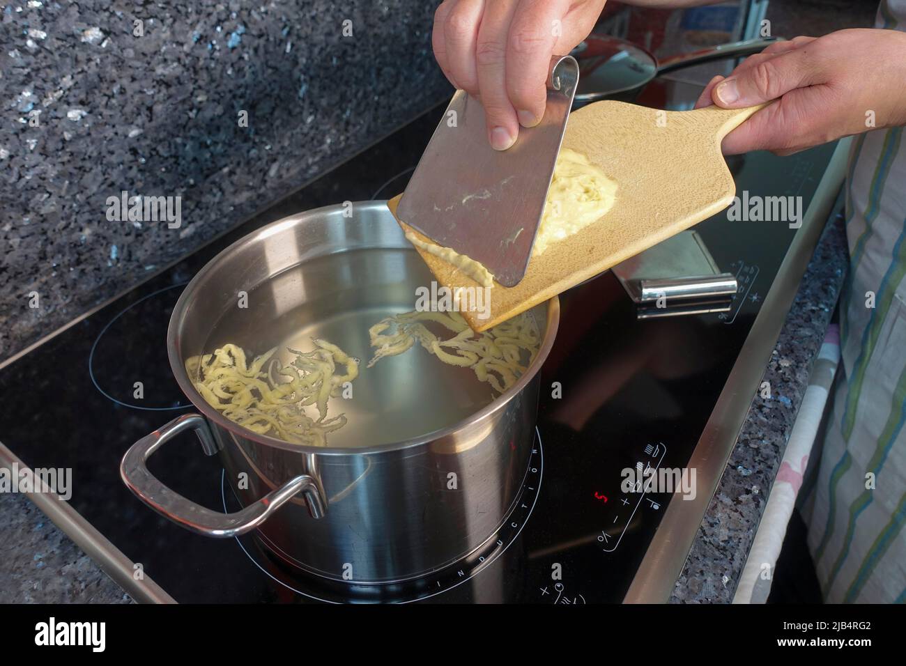 Swabian cuisine, preparation of hand-scraped spaetzle for spaetzle ...
