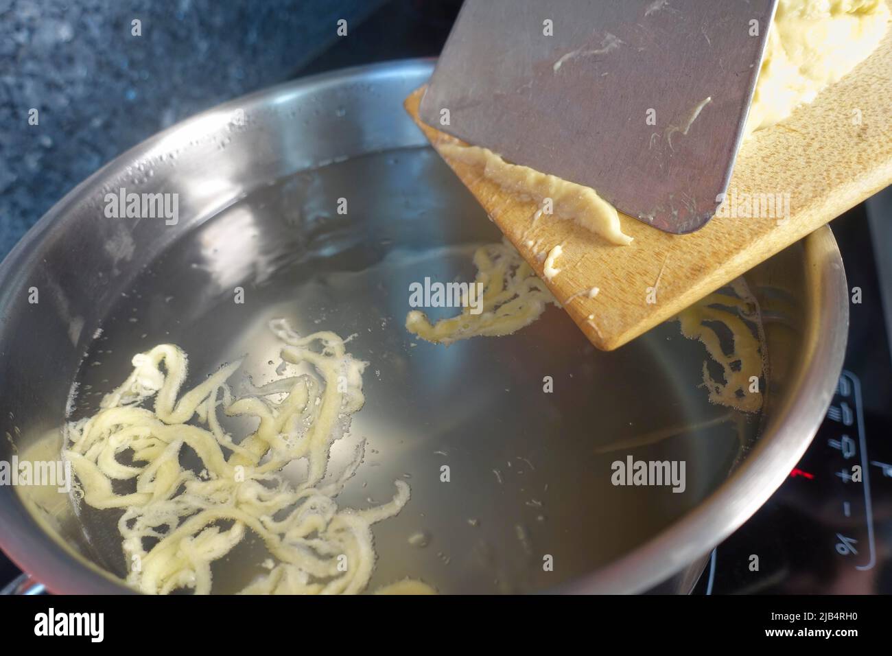 Swabian cuisine, preparation of hand-scraped spaetzle for spaetzle ...