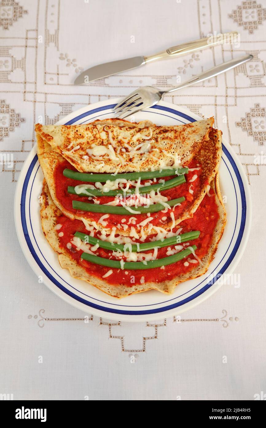 Swabian cuisine, stuffed pancakes hearty with green beans, tomato sauce ...