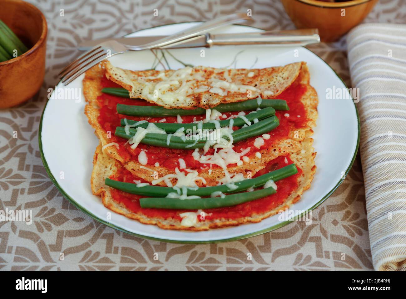 Swabian cuisine, stuffed pancakes hearty with green beans, tomato sauce ...