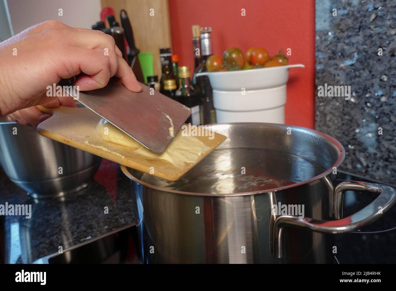 Swabian cuisine, preparation of hand-scraped spaetzle for spaetzle ...