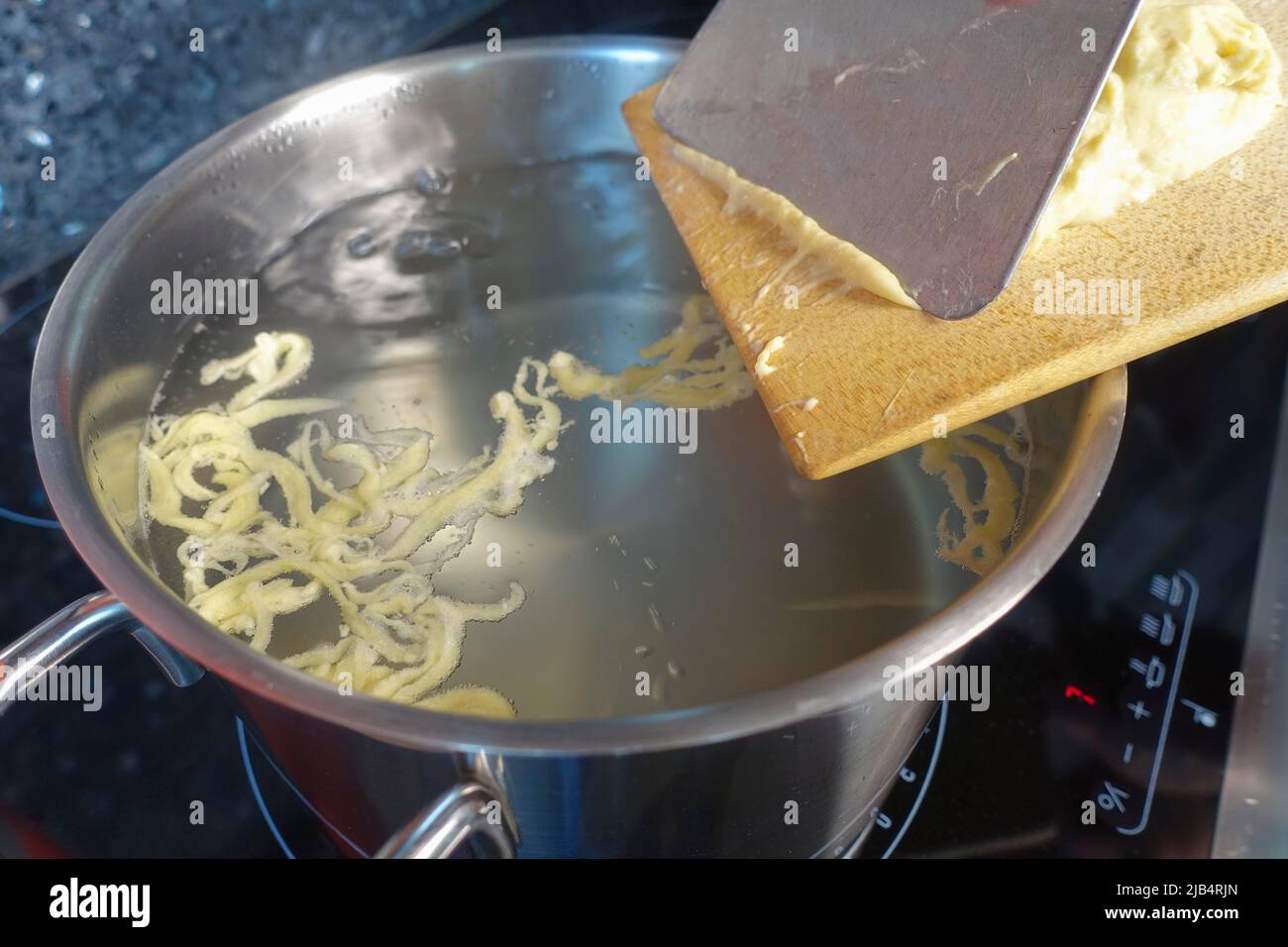 Swabian cuisine, preparation of hand-scraped spaetzle for spaetzle ...