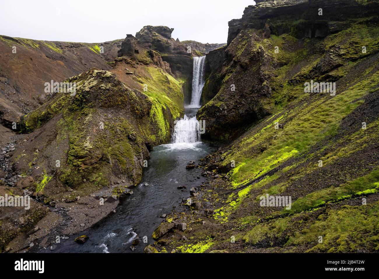 Waterfall, Ragged canyon overgrown with moss, River Skoga, Landscape at ...