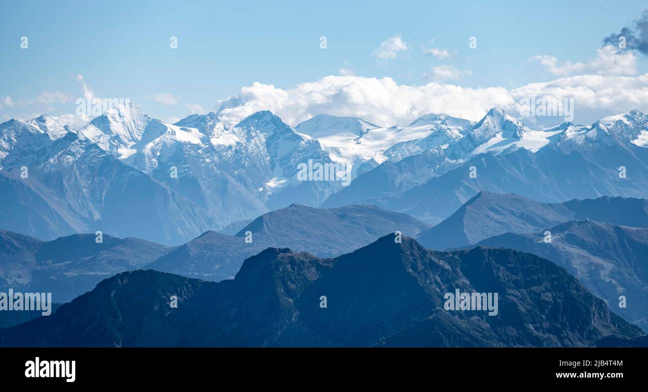 Snow-covered mountain peaks on the main ridge of the Alps ...