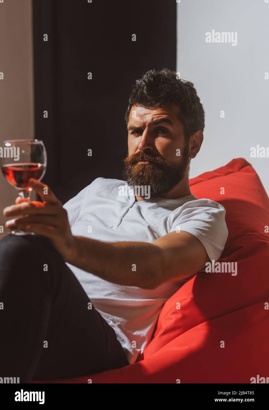 Man in depression drinking wine. Alcohol addiction. Home alone drunk ...