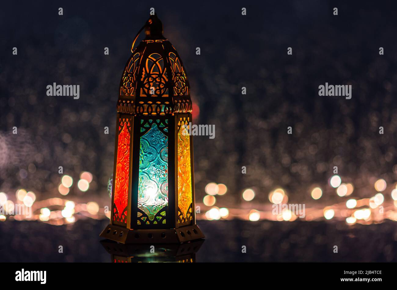 Lantern with lights decorating for Islamic new year put at window with ...