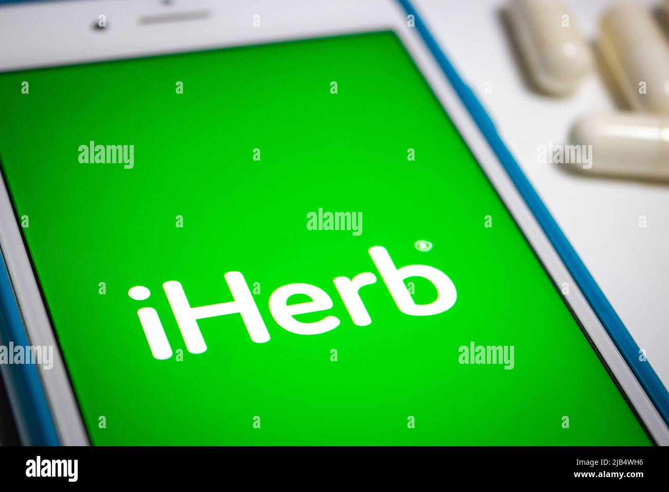 Kumamoto, Japan - Jul 23 2020 : Close up of iHerb logo on iPhone with ...