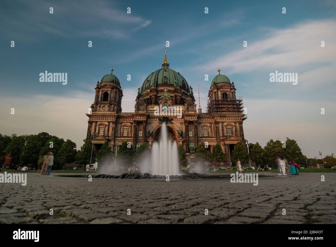 Outside view of Berlin cathedral or Dom, with visible fountain and some ...