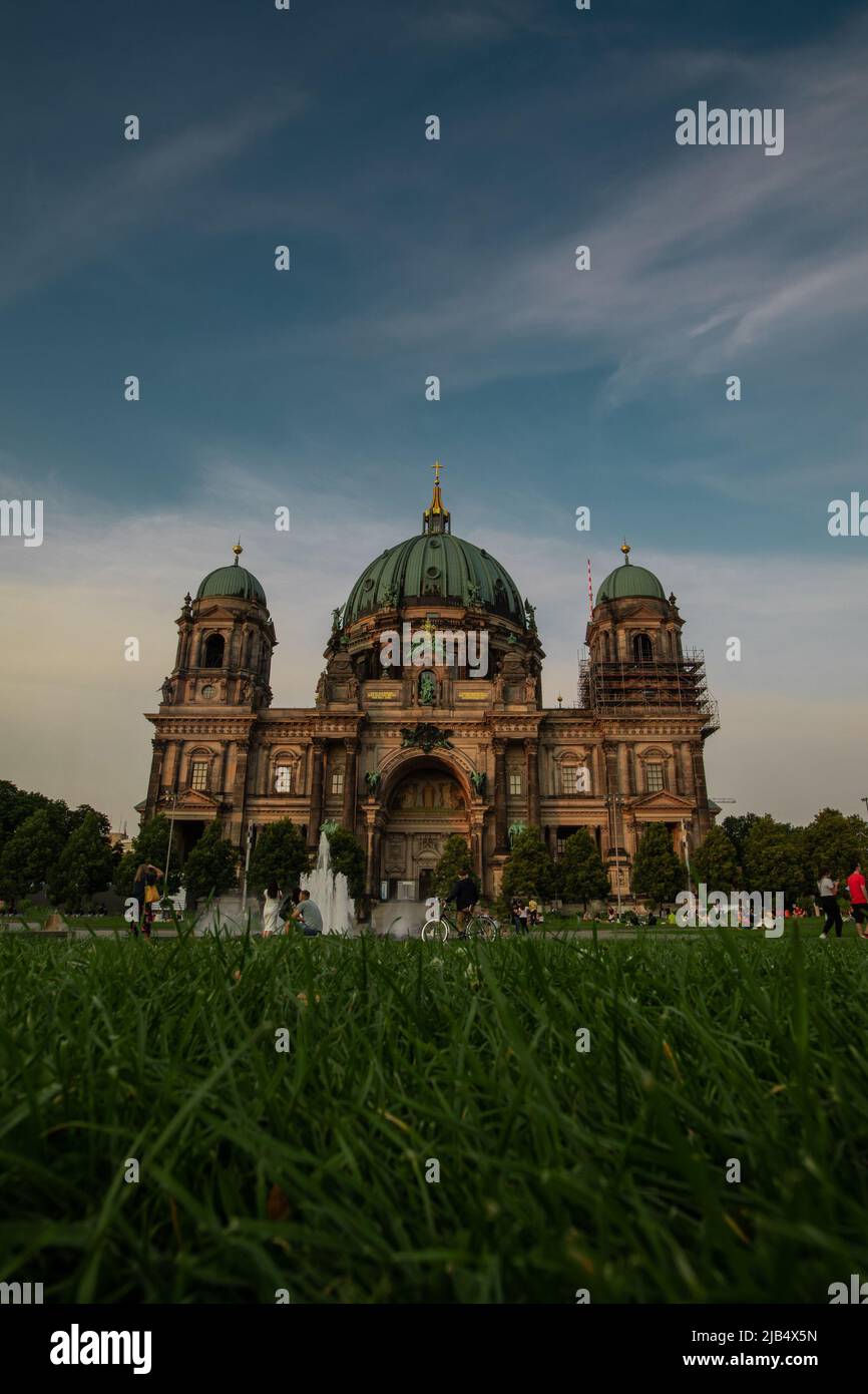 Outside view of Berlin cathedral or Dom, with visible fountain and some ...