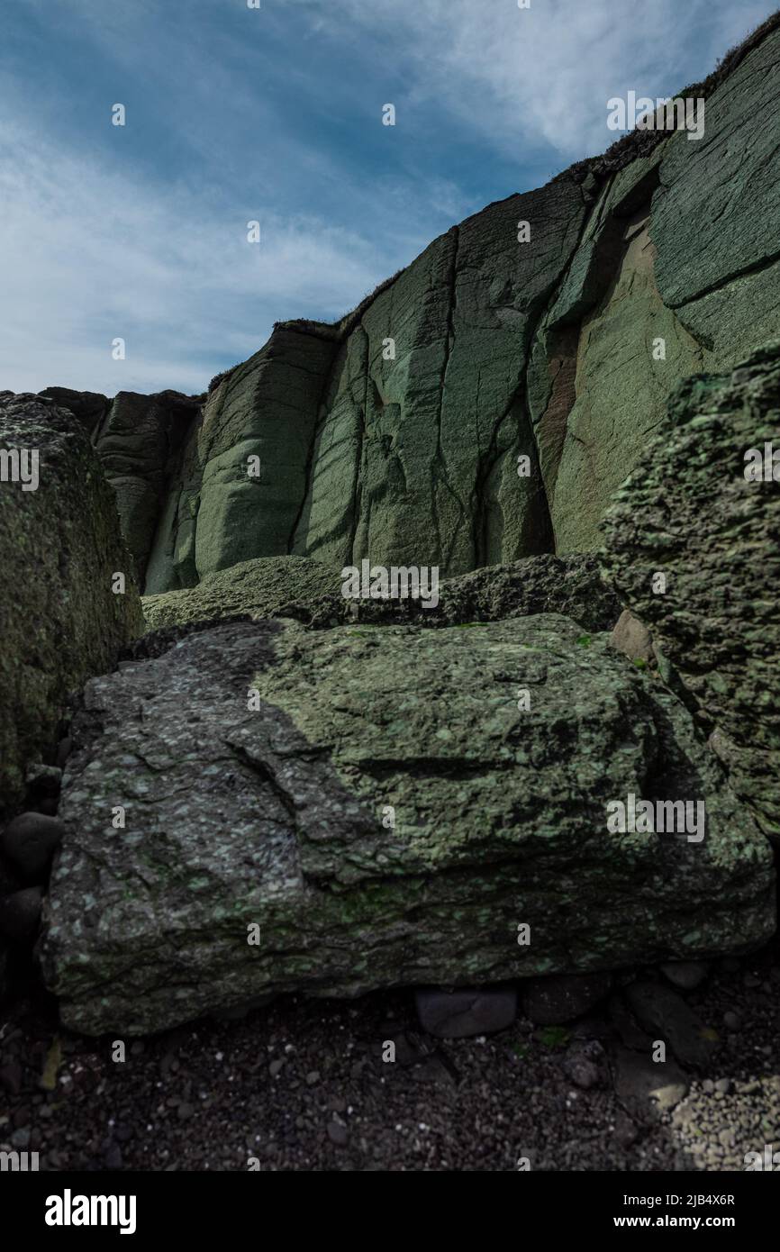 Green ignimbrite rock formations on the beach in southern iceland ...