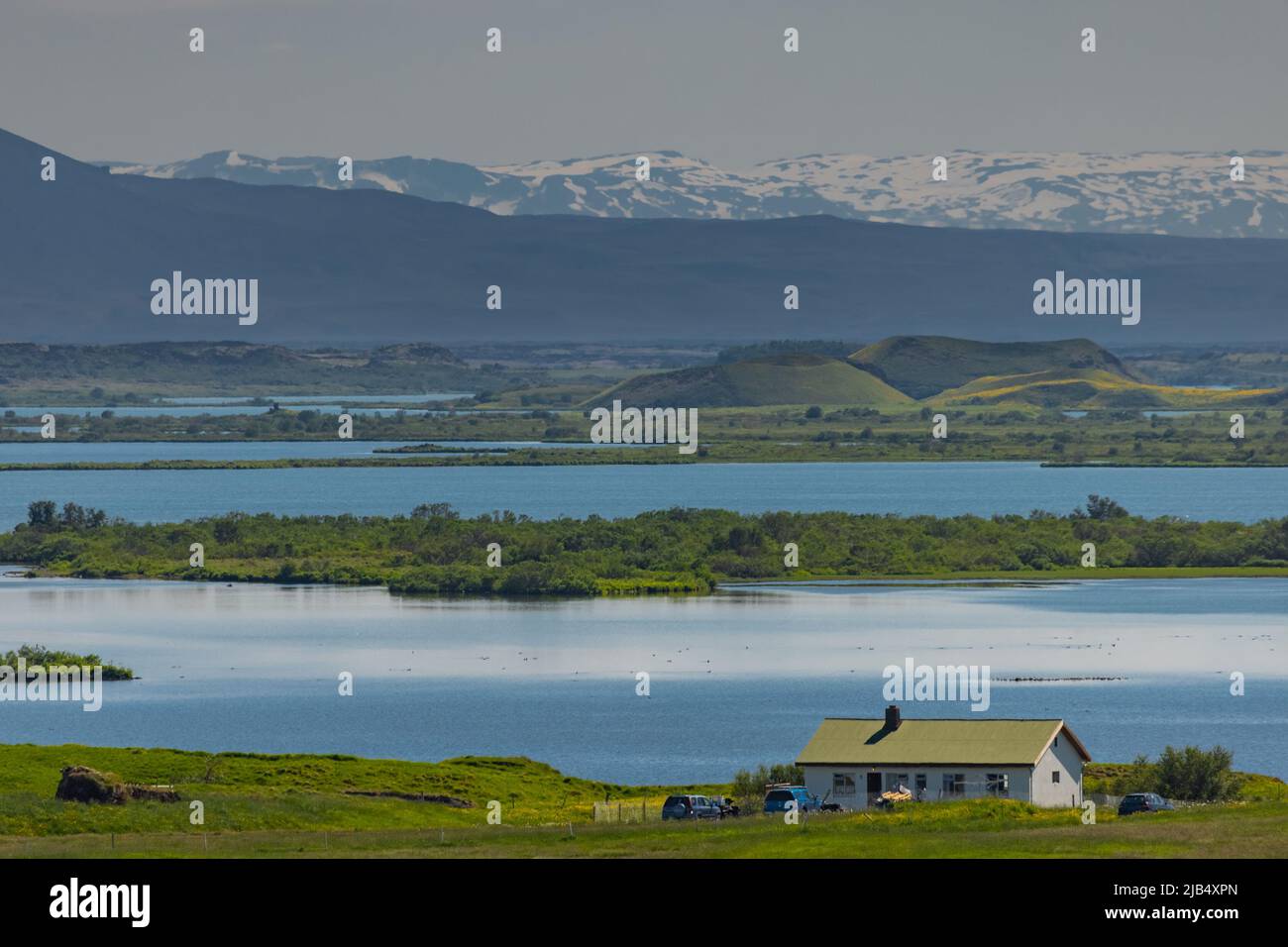 Panorama of shores with farms on lake myvatn on iceland on a sunny day ...