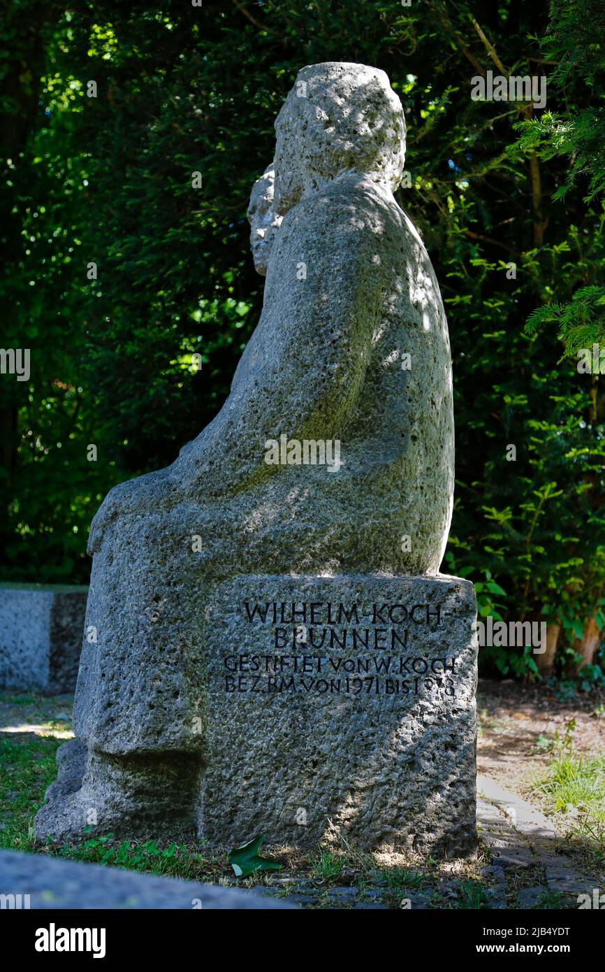 Wilhelm Koch fountain, park, stone figures, couple sitting in front of ...