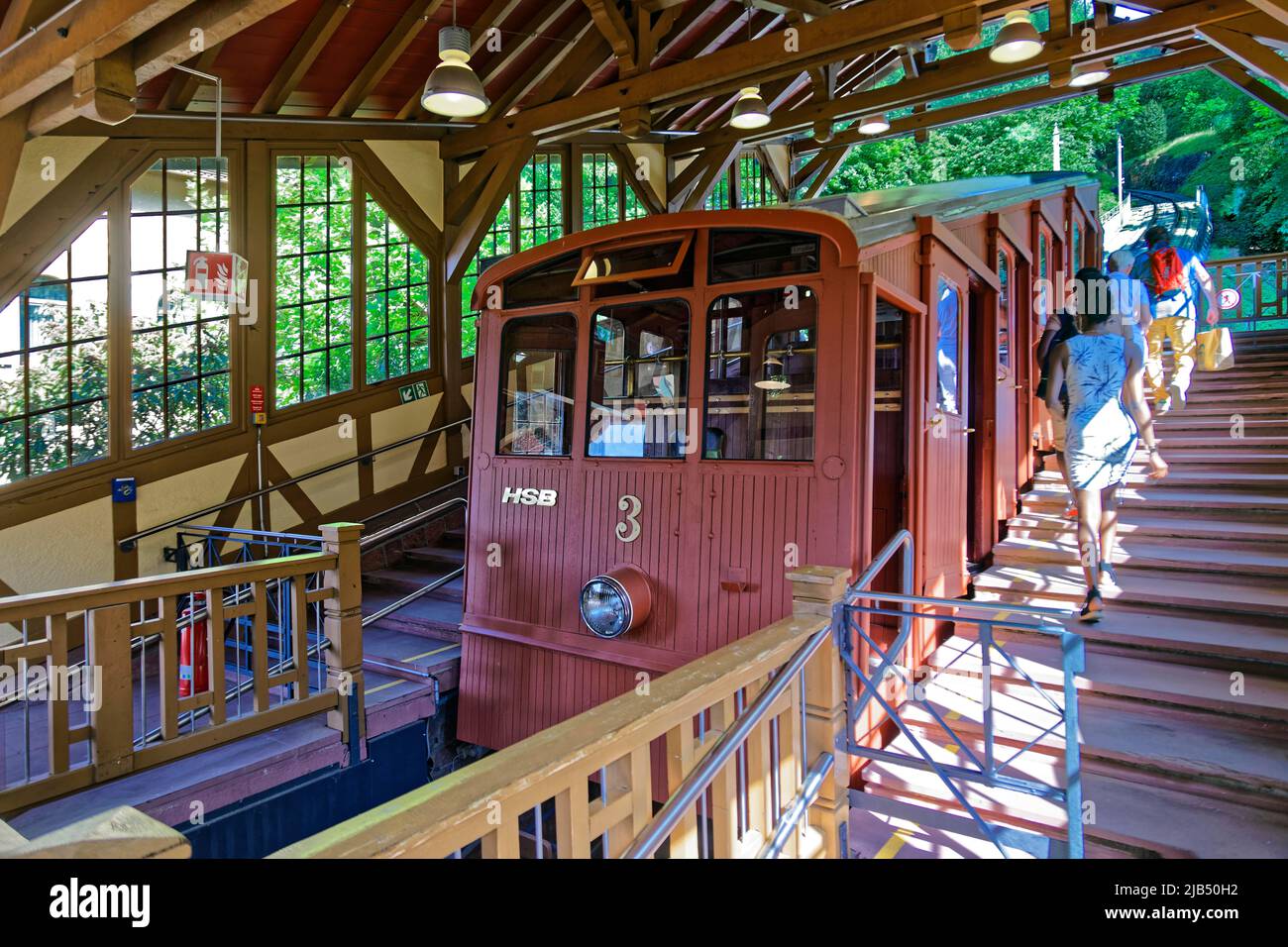 Passengers boarding carriages in upper mountain railway in Molkenkur ...